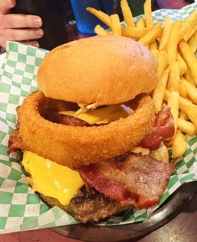 The Roadhouse Burger towers with bacon and an onion ring crown &ndash; because sometimes more is more, and subtlety is overrated.
