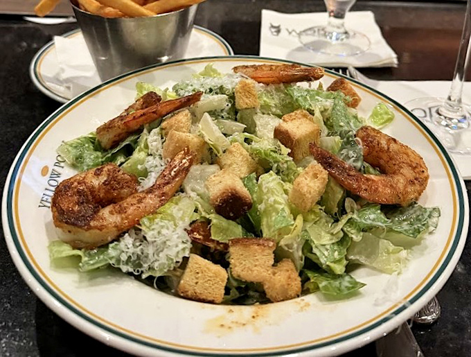 A Caesar salad that actually makes you excited about eating lettuce, with plump shrimp that clearly lived their best lives.