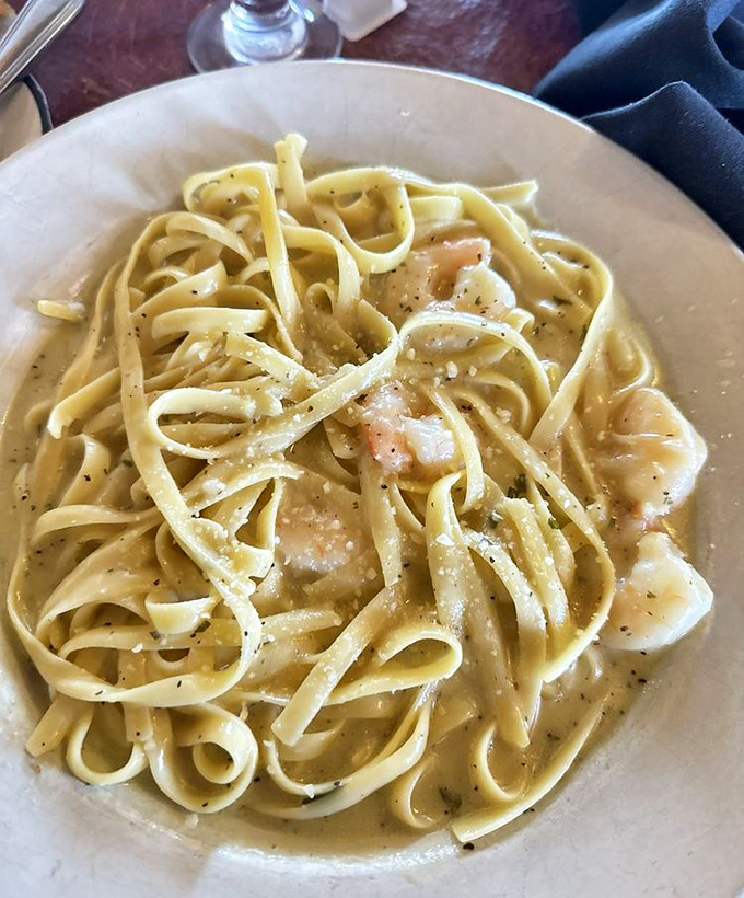 Plump shrimp nestled among ribbons of pasta coated in silky sauce &ndash; the kind of dish that makes you close your eyes with each twirl of the fork.