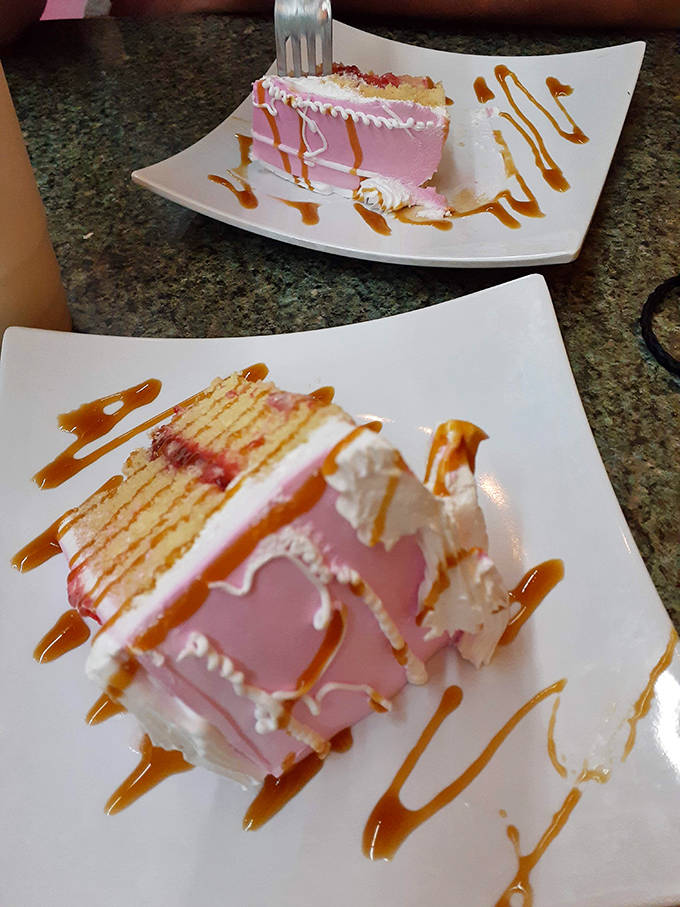 Tres Leches cake that's worth saving room for, a sweet symphony of milk-soaked sponge topped with whipped cream and caramel drizzle.