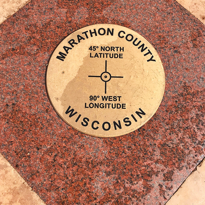 That bronze medallion is basically the belly button of the Northwest Hemisphere, and yes, you can touch it.