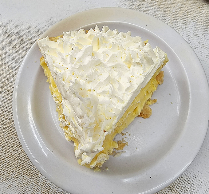 Coconut cream pie piled high with whipped cream provides the sweet ending your savory feast deserves, no questions asked.