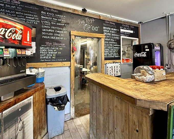 Rustic charm meets seafood expertise – the weathered wood counter tells stories of countless delicious meals served with pride.