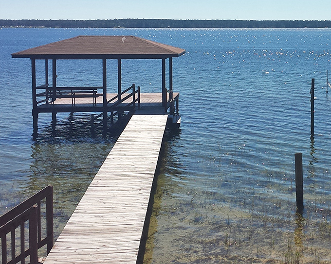 A covered gazebo waits patiently at dock's end, the perfect spot for sunset watching or escaping afternoon showers.