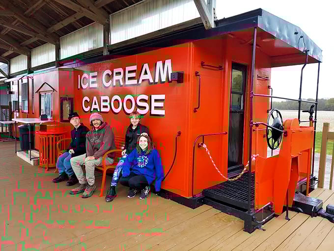 All aboard the flavor express! Visitors enjoying the unique experience of ice cream served from an authentic train caboose.