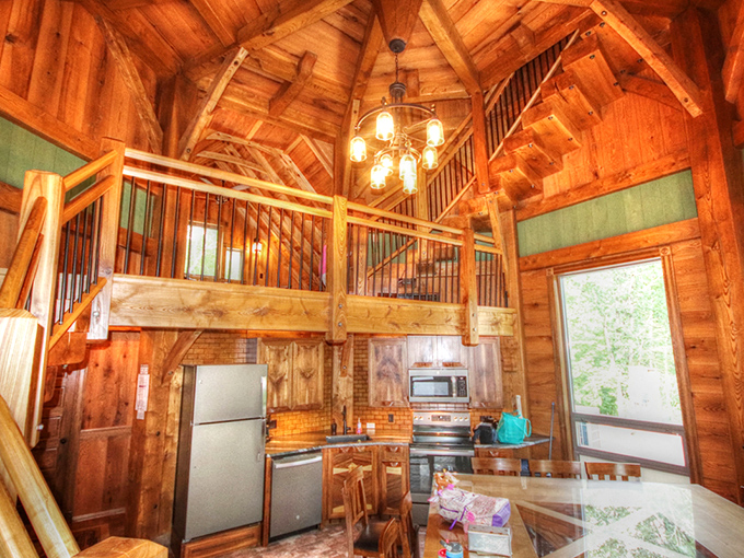 Inside, soaring ceilings and exposed beams create a space that feels both grand and intimate &ndash; architectural poetry in wood.