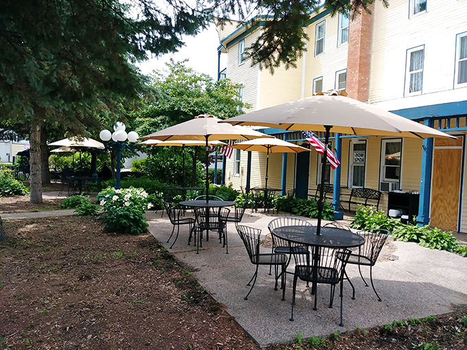 Outdoor dining under umbrellas lets you enjoy your meal while contemplating whether that shadow moved or you're just jumpy.