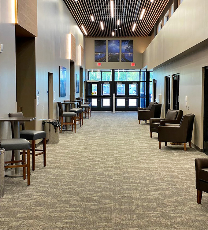 Modern seating areas offer the perfect vantage point for tired skaters or chatting parents between ice adventures.