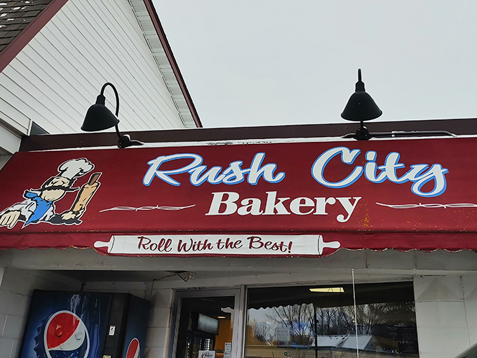 "Roll with the best" is more than just a slogan! Rush City Bakery's classic sign promises and delivers donut excellence in every batch.