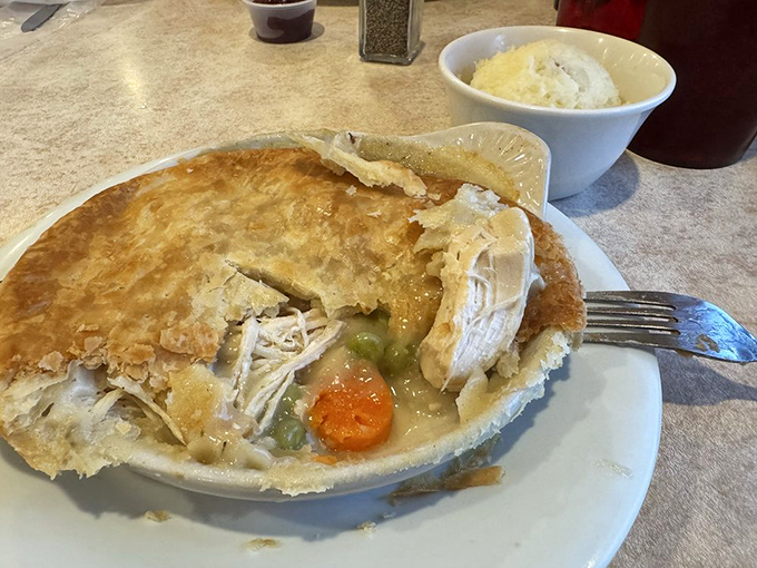 Lift the golden dome of this chicken pot pie to discover the steaming treasure beneath &ndash; comfort food that's worth the drive.