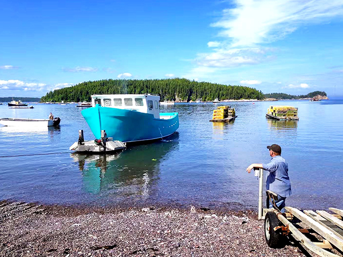 Working lobster boats dot the harbor, a colorful reminder that this unique accommodation once shared their daily purpose.
