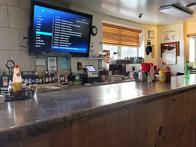 The counter serves as command central, where locals gather for morning coffee and travelers discover the secret behind this unassuming spot.