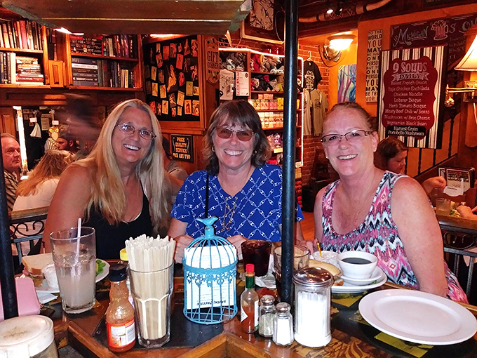 Happy patrons enjoying the unique atmosphere where food, literature, and laughter come together. The best conversations happen over good food!