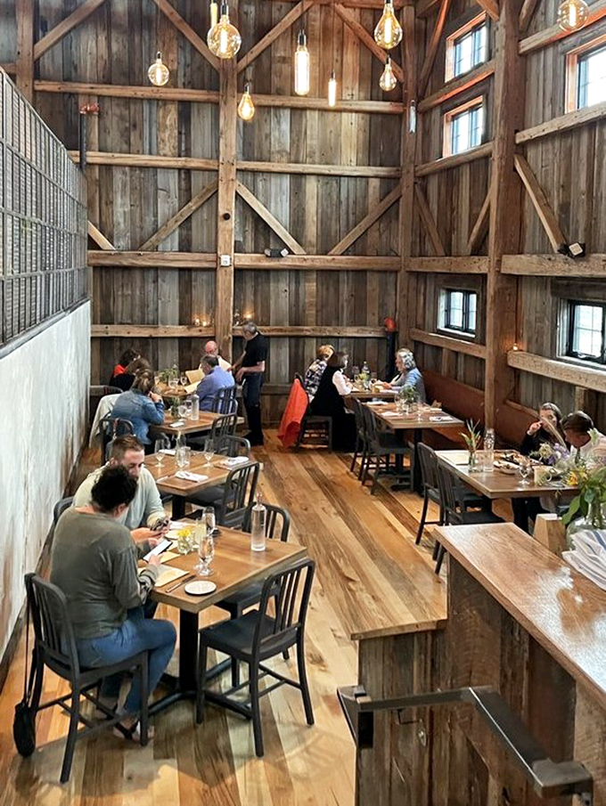 Diners gather beneath towering wooden beams, where centuries of history create a backdrop for new memories made over exceptional meals.