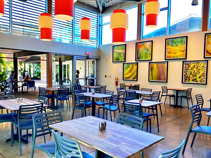The airy dining area features sleek furniture and abundant natural light, creating a contemporary space where garden views take center stage.