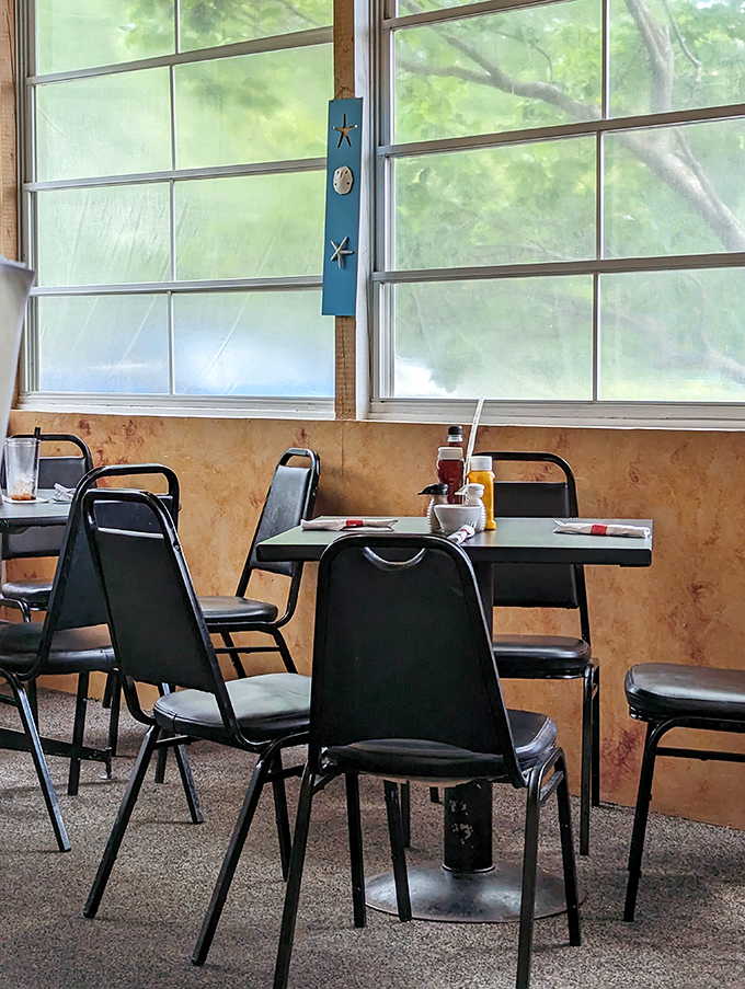 Exposed beams and natural light create dining spaces where conversations flow as smoothly as the coffee refills.