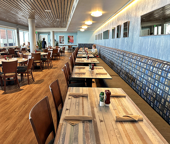 The dining area manages to feel both spacious and intimate, with those blue accents echoing the Gulf waters just outside.