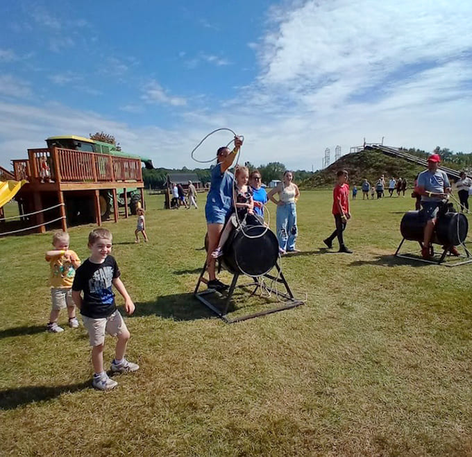 Young cowboys and cowgirls practice their roping skills on stationary targets, learning techniques that won't result in accidentally lassoing their siblings.