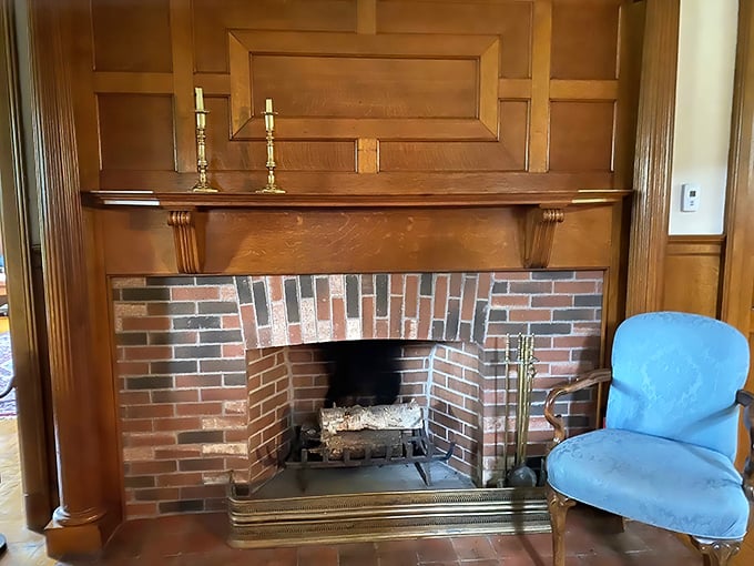 Warmth and welcome: The brick fireplace creates a cozy focal point, perfect for afternoon conversations over tea.