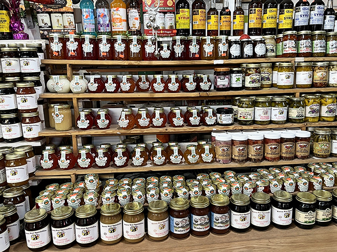 Sweet liquid gold! Rows of homemade jams, preserves, and syrups line these shelves, each jar containing sunshine and flavor in equal measure.