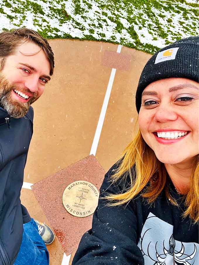 This humble stone marker represents a geographical bullseye that would make even the most stoic mathematician smile with delight.