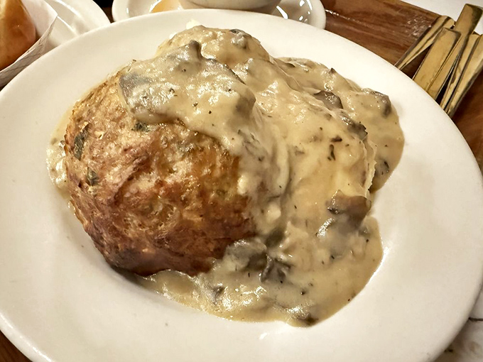 This meatball isn't playing games. Hefty, perfectly seasoned, and swimming in mushroom gravy so good you'll want to eat it all.