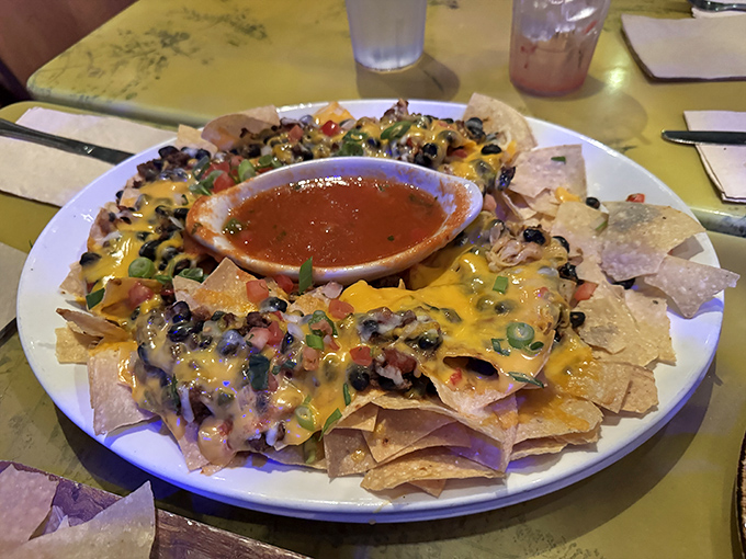 Loaded nachos that could feed a small herd of herbivores &ndash; a shareable appetizer that disappears faster than dinosaurs after the meteor.