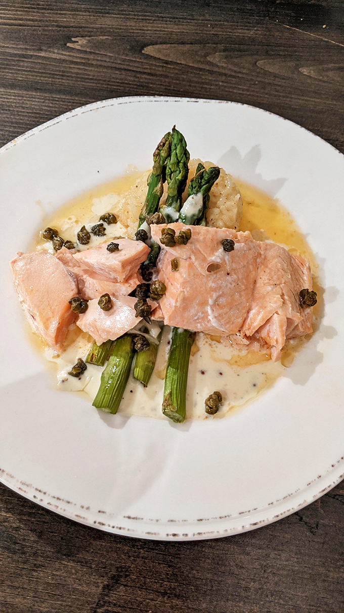 Salmon and asparagus – a classic pairing elevated by impeccable technique and a delicate sauce with capers adding briny punctuation.