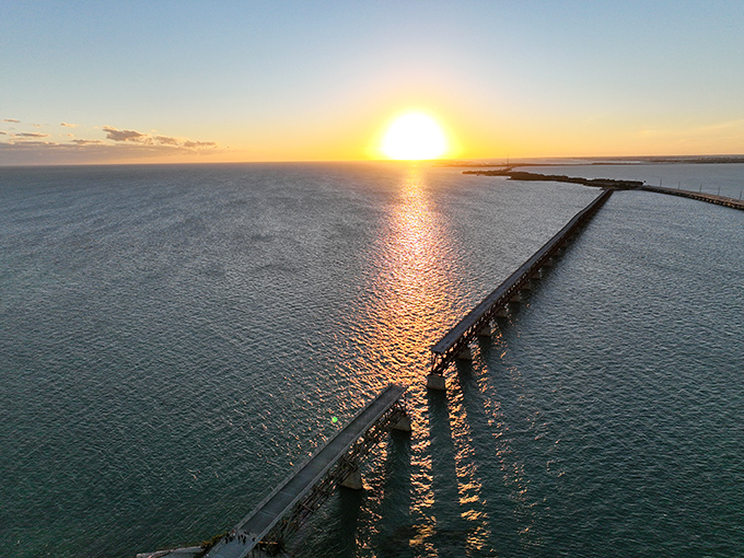 Sunset magic hour transforms the old railway bridge into a silhouette against a sky painted in impossible colors.