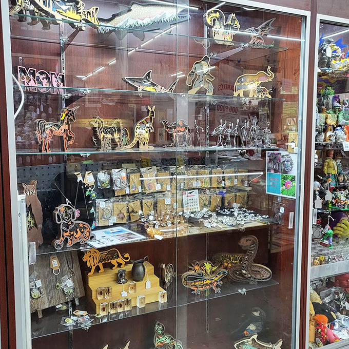 This display case holds a miniature zoo of delicate glass and metal creatures. Collecting these was practically a competitive sport in the 1960s!