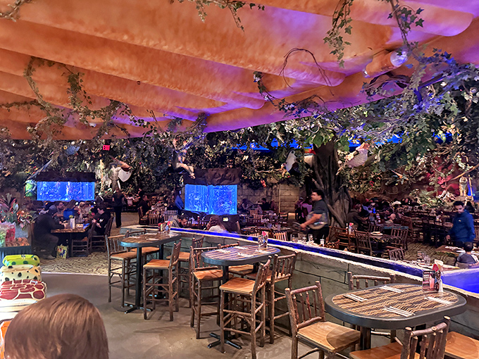 The dining room transforms ordinary meals into extraordinary adventures, with a ceiling that occasionally erupts into tropical thunderstorms.