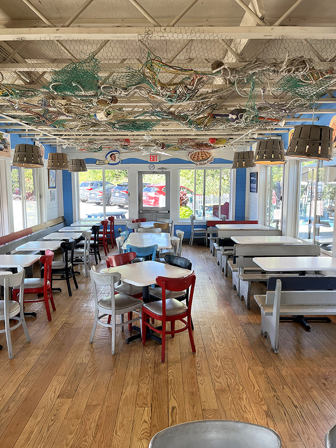 The dining room's fishing net ceiling installation &ndash; not just decoration, but a reminder of where your meal began its journey.