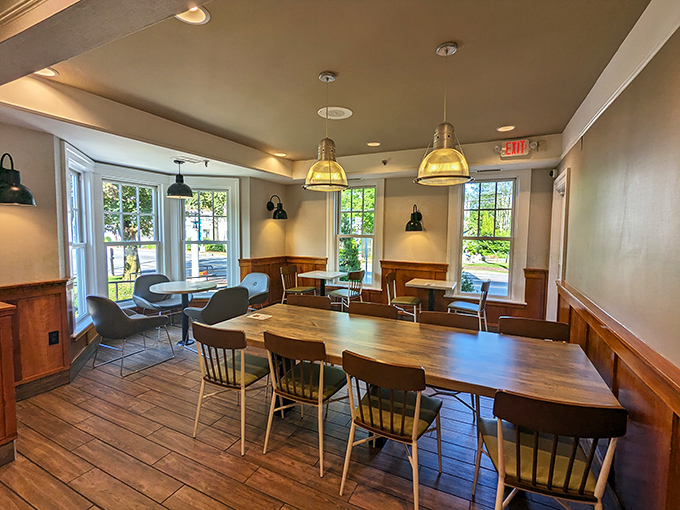 Sunlight streams through historic windows: The restaurant's thoughtfully designed interior preserves architectural details while accommodating modern dining needs. 