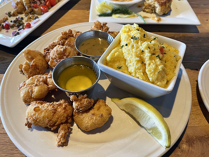 Golden-fried treasures from the deep &ndash; these crispy morsels come with creamy polenta that's worth fighting over when the seafood's gone.