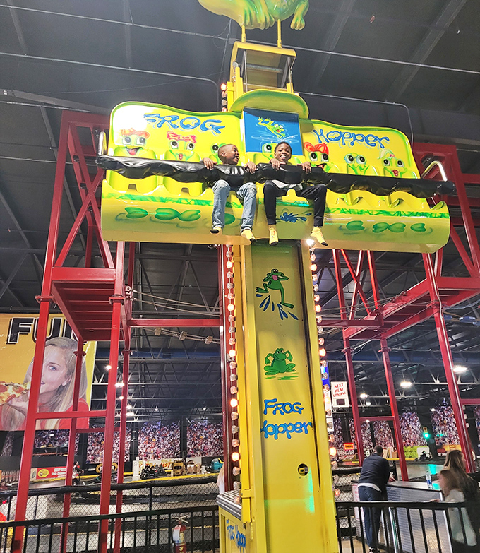 Frog hopper: Little ones experience the perfect introduction to thrill rides, their expressions shifting from uncertainty to pure joy with each gentle bounce.