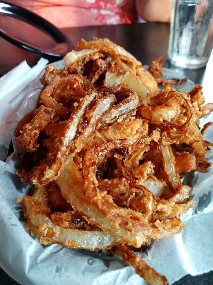 These aren't just onion rings &ndash; they're crispy, golden halos of flavor that maintain their satisfying crunch from first bite to last.