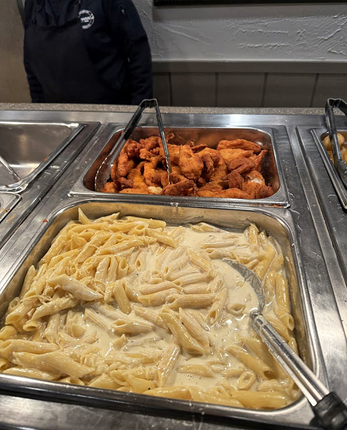 The buffet line showcases Tinucci's commitment to freshness &ndash; those crispy chicken pieces won't last long before needing replenishment!
