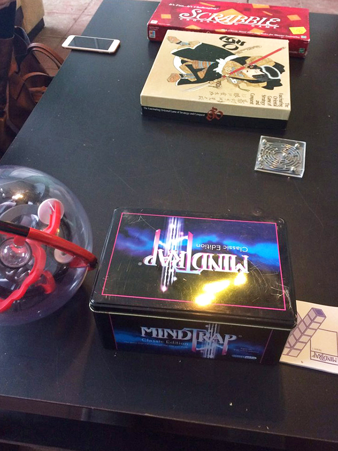 Classic games like Scrabble and Mind Trap entertain early arrivals, warming up their puzzle-solving skills before the main magical challenge begins.