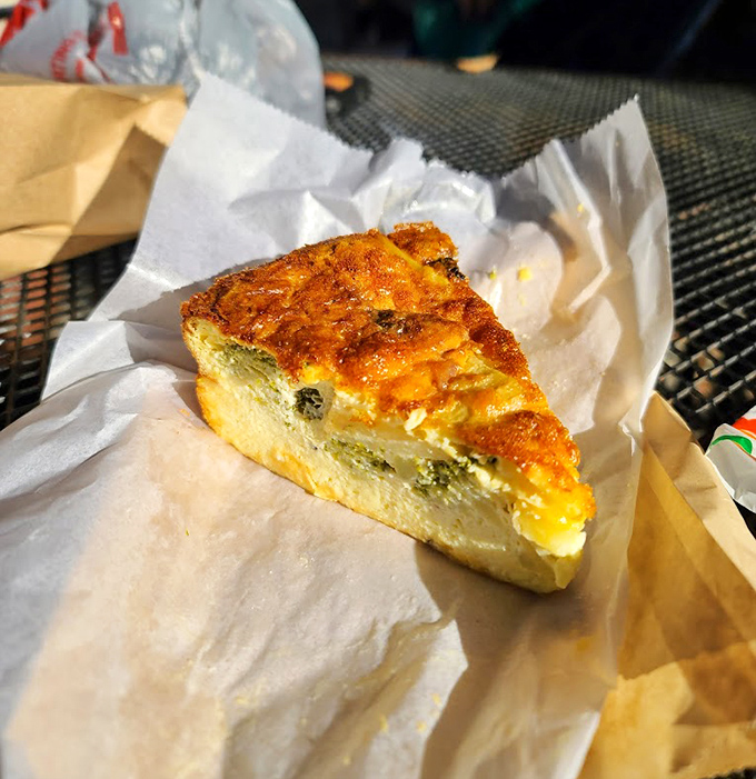 This quiche slice has that perfect wobble that tells you it's going to be creamy, rich, and worth every single calorie.