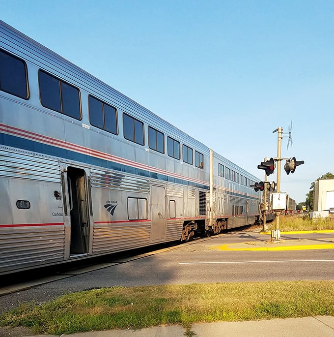 Silver streak against green fields &ndash; the Amtrak train makes its brief stop before continuing its cross-country journey.