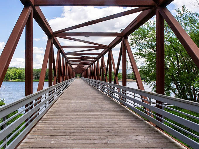 Looking down the bridge's corridor feels like peering through a time tunnel, with each step revealing new perspectives.