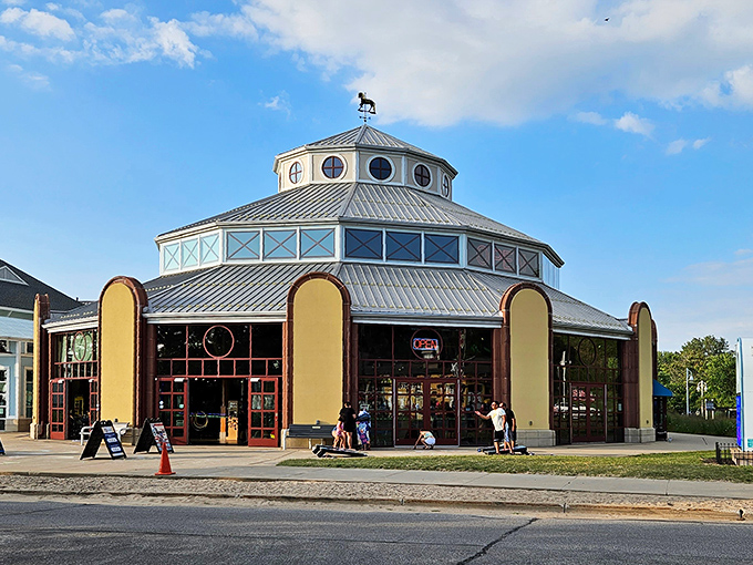 The Silver Beach Carousel's distinctive octagonal building invites visitors to step inside and rediscover childhood joy on a merry-go-round by the lake.