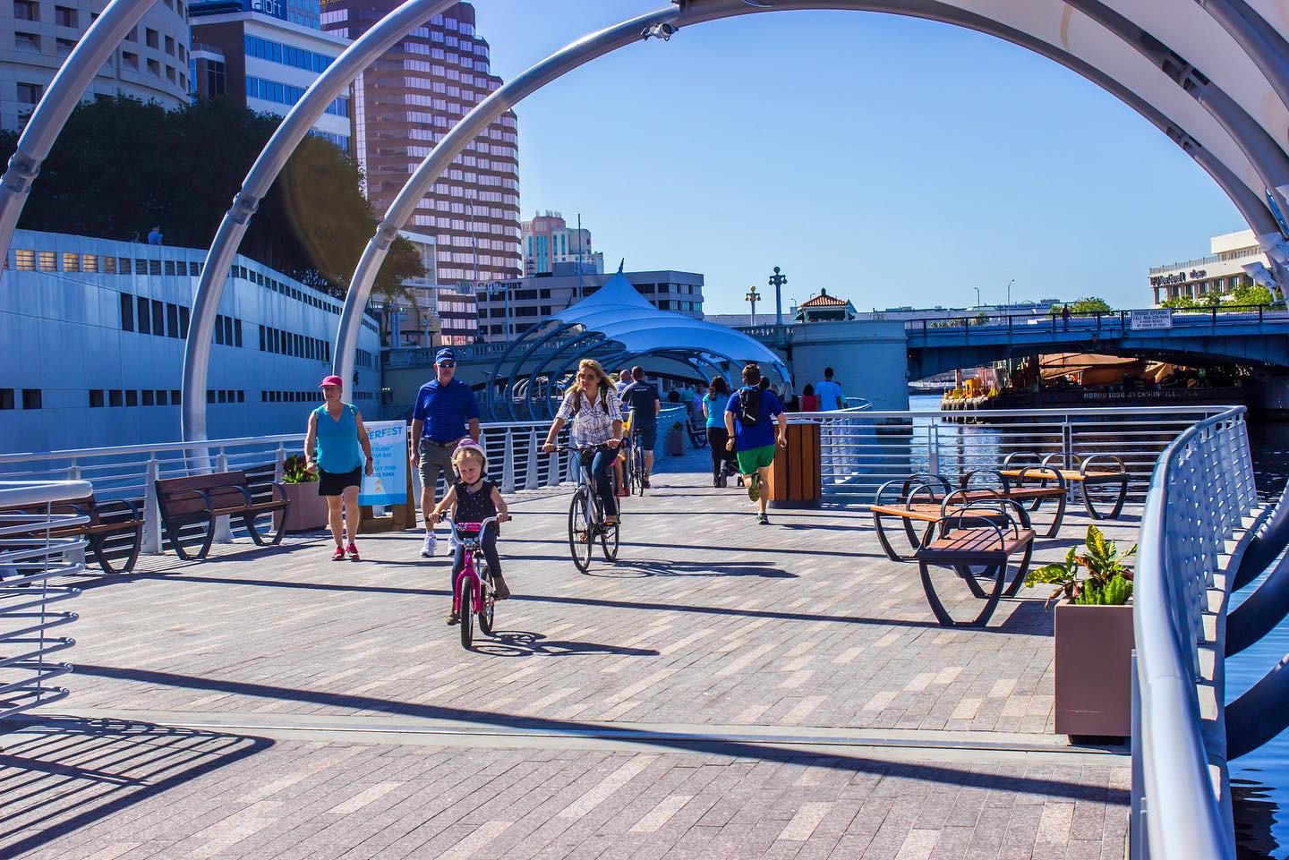 A beautiful day at the Tampa riverwalk with by passers enjoying their strolls