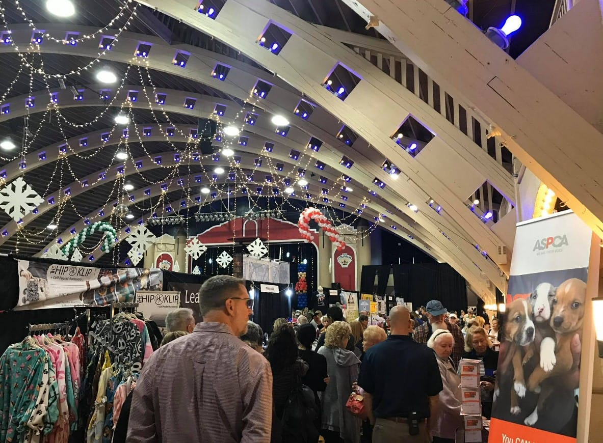 a bunch of people shopping at the market