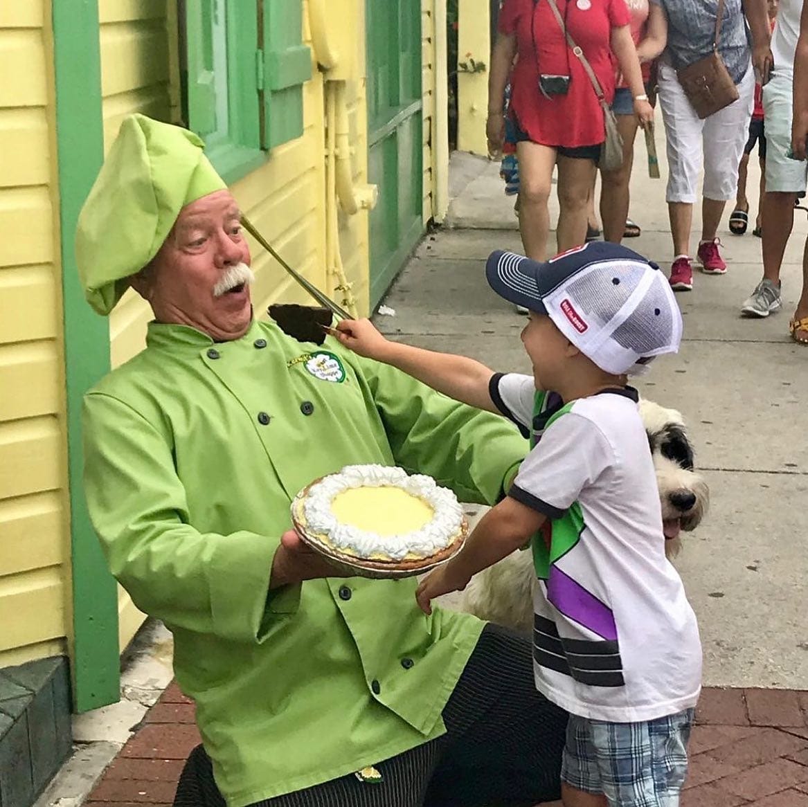 A goofy image of Mr Kermit and a child