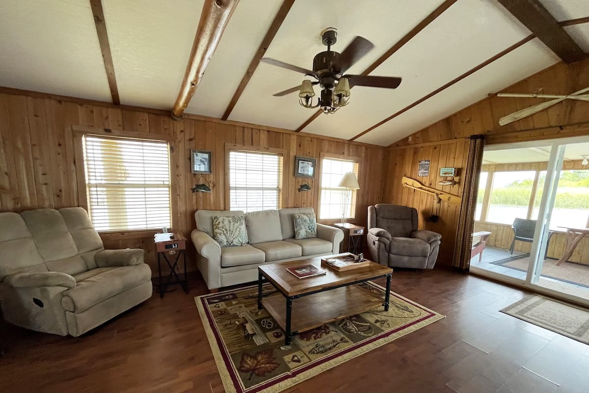 A spacious living area with comfy sofas