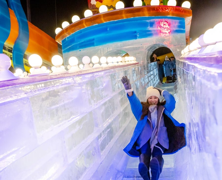a woman enjoying the ice slides at the resort