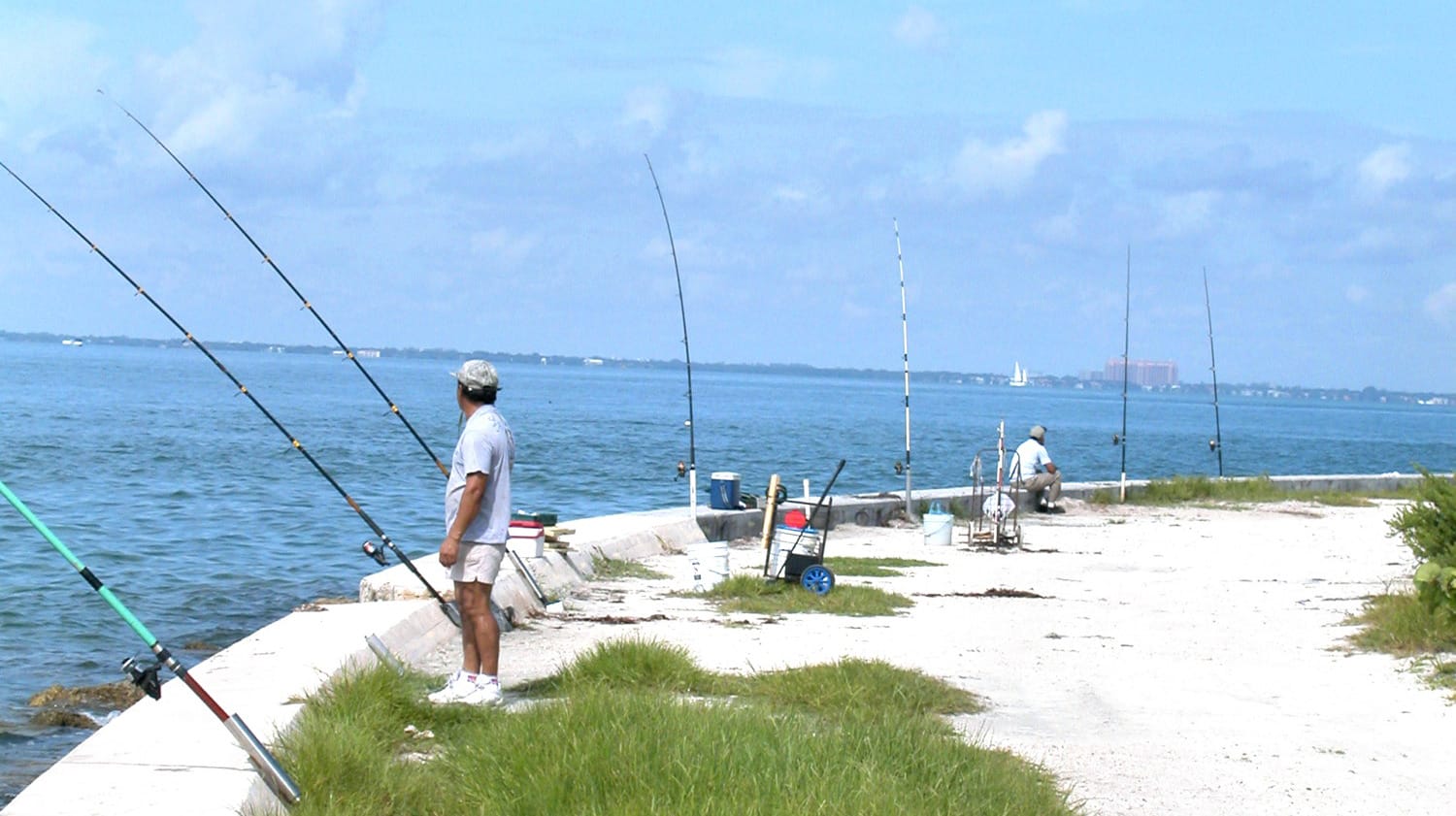 fishing from the seawall beside the lighthouse