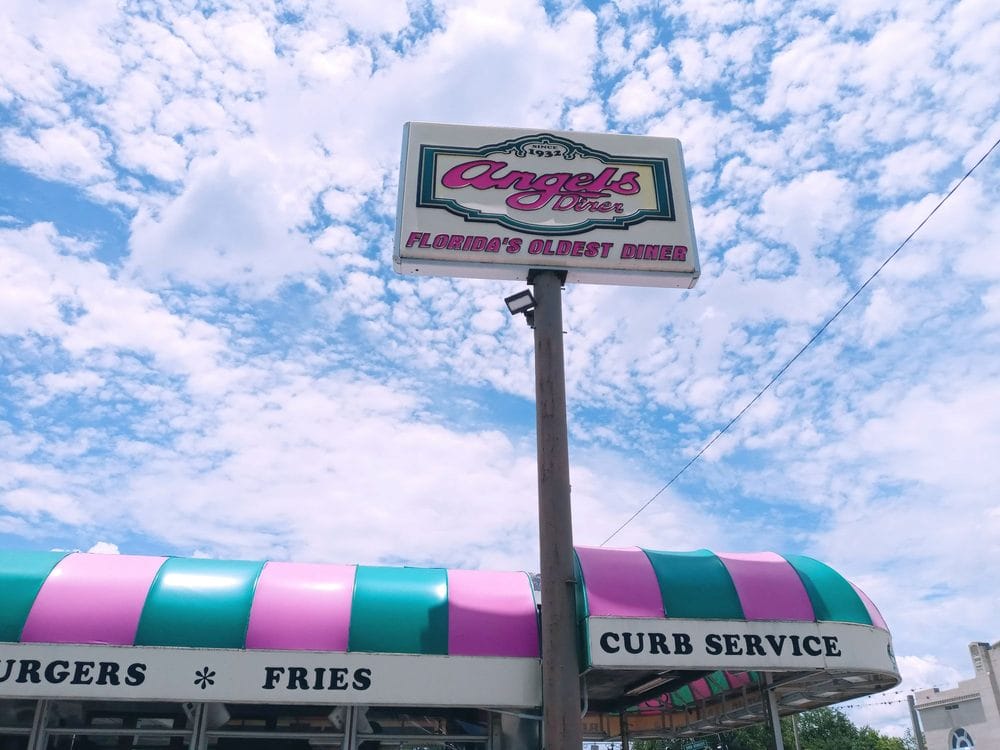 image of angels diners exterior sign proclaiming it as floridas oldest diner
