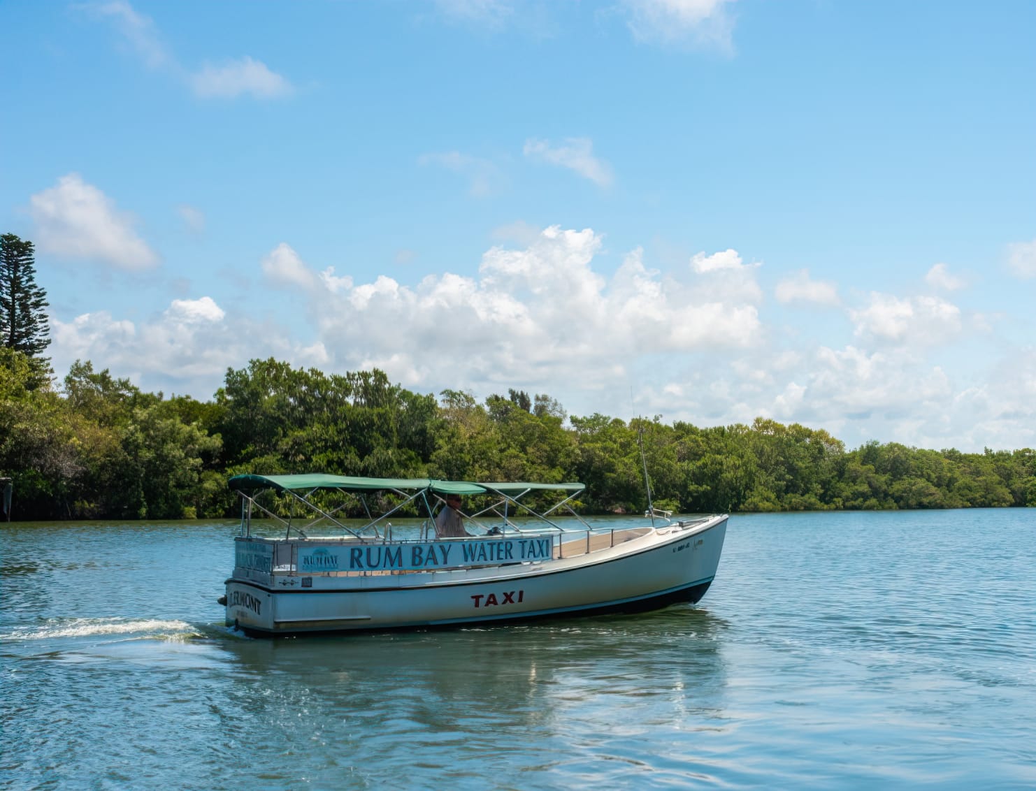 rum bay water taxi cruising on the water to the island